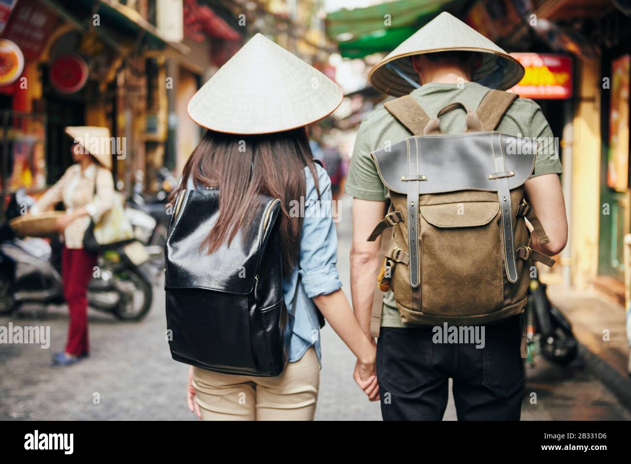 Back view of tourist with backpack exploring the city Stock Photo - Alamy