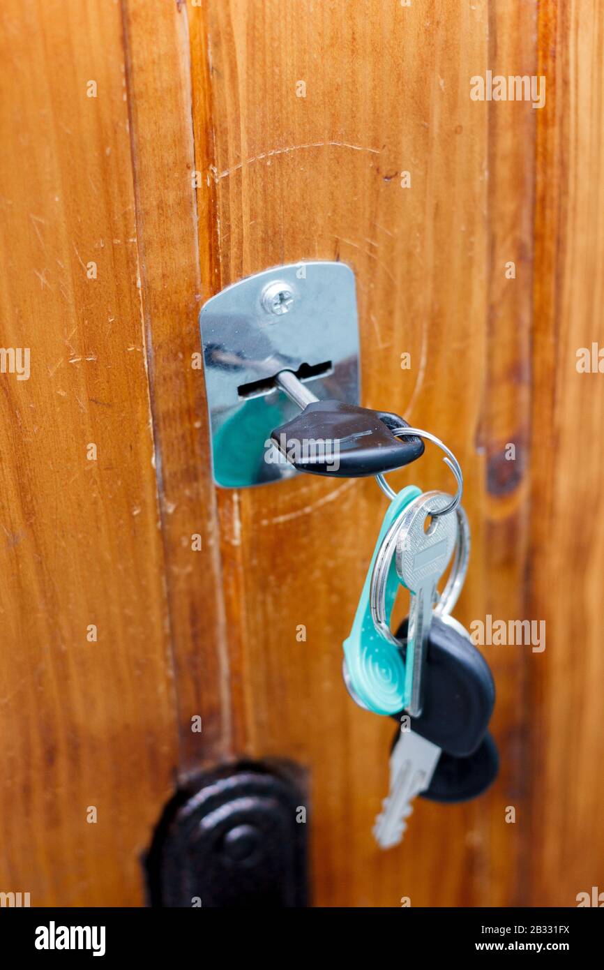 Door with the keys in lock keyhole Stock Photo - Alamy