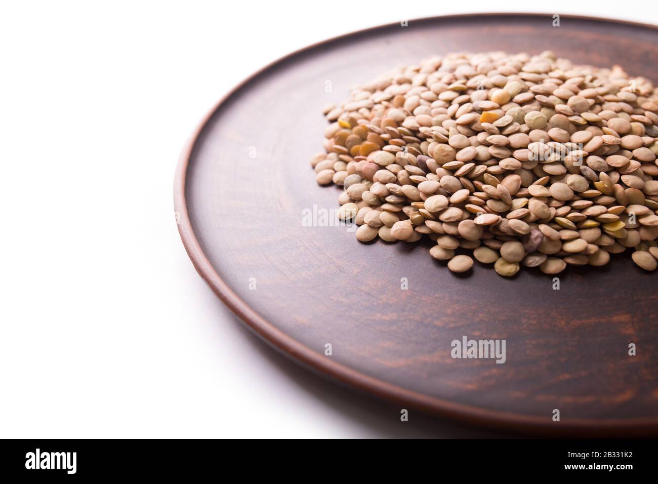 green lentils on a plate, isolated on white, with copy space Stock ...