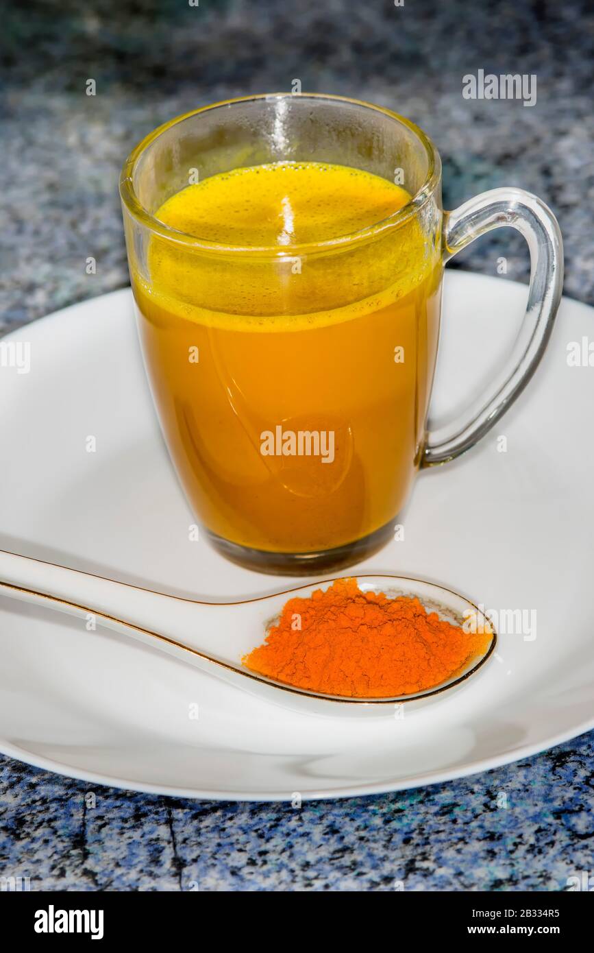 turmeric milk and turmeric powder Stock Photo - Alamy
