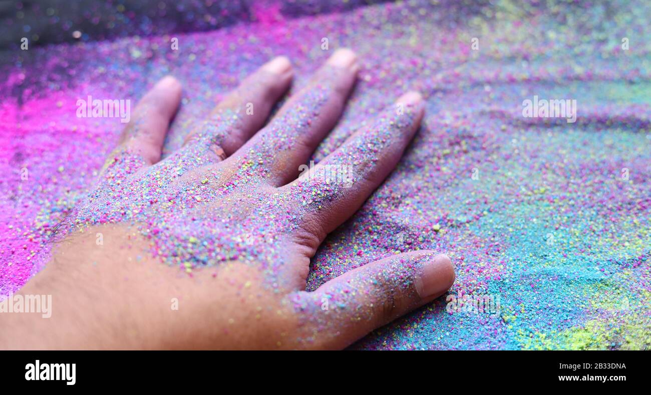 Color in hand , Indian Festival Holi Background Stock Photo - Alamy