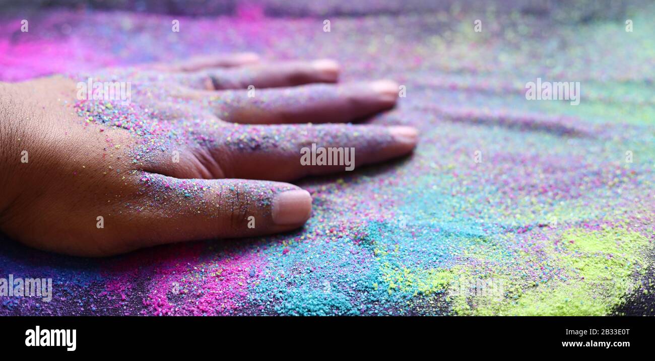 Color in hand , Indian Festival Holi Background Stock Photo - Alamy