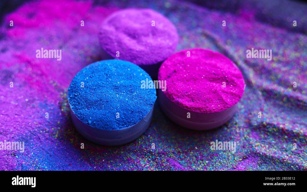 Colorful holi powder in bowls isolated on dark background Stock Photo ...
