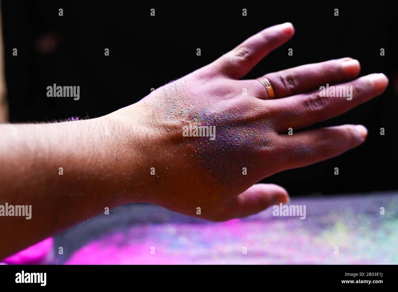 Color in hand , Indian Festival Holi Background Stock Photo - Alamy