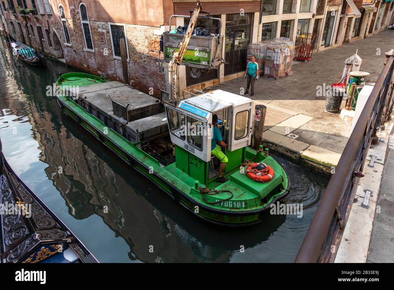 Venice garbage canal boat hi-res stock photography and images - Alamy