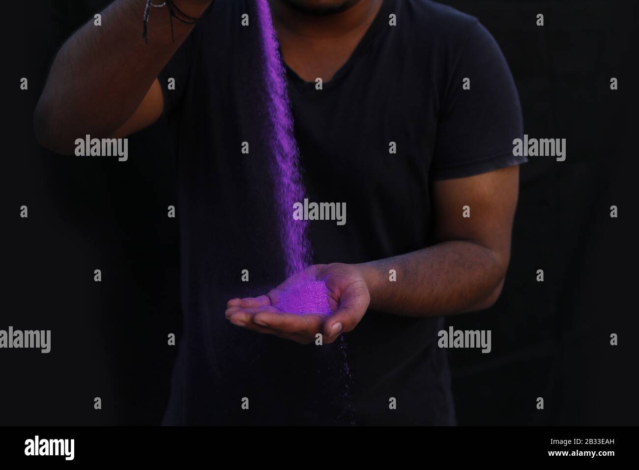Hand holding colorful powder cupped in the palm for Holi festival of ...