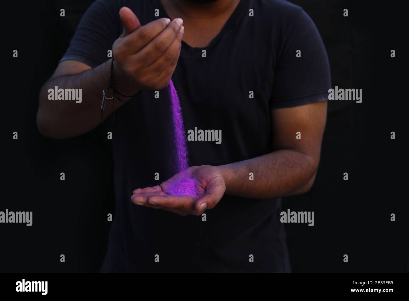 Hand holding colorful powder cupped in the palm for Holi festival of ...