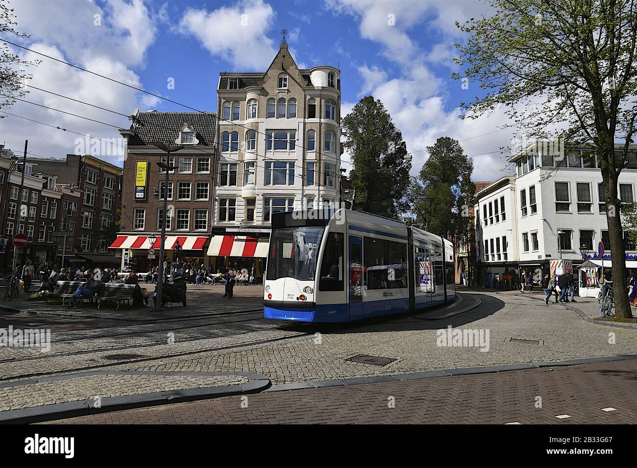 Tram passing town square Amsterdam Netherlands Stock Photo - Alamy