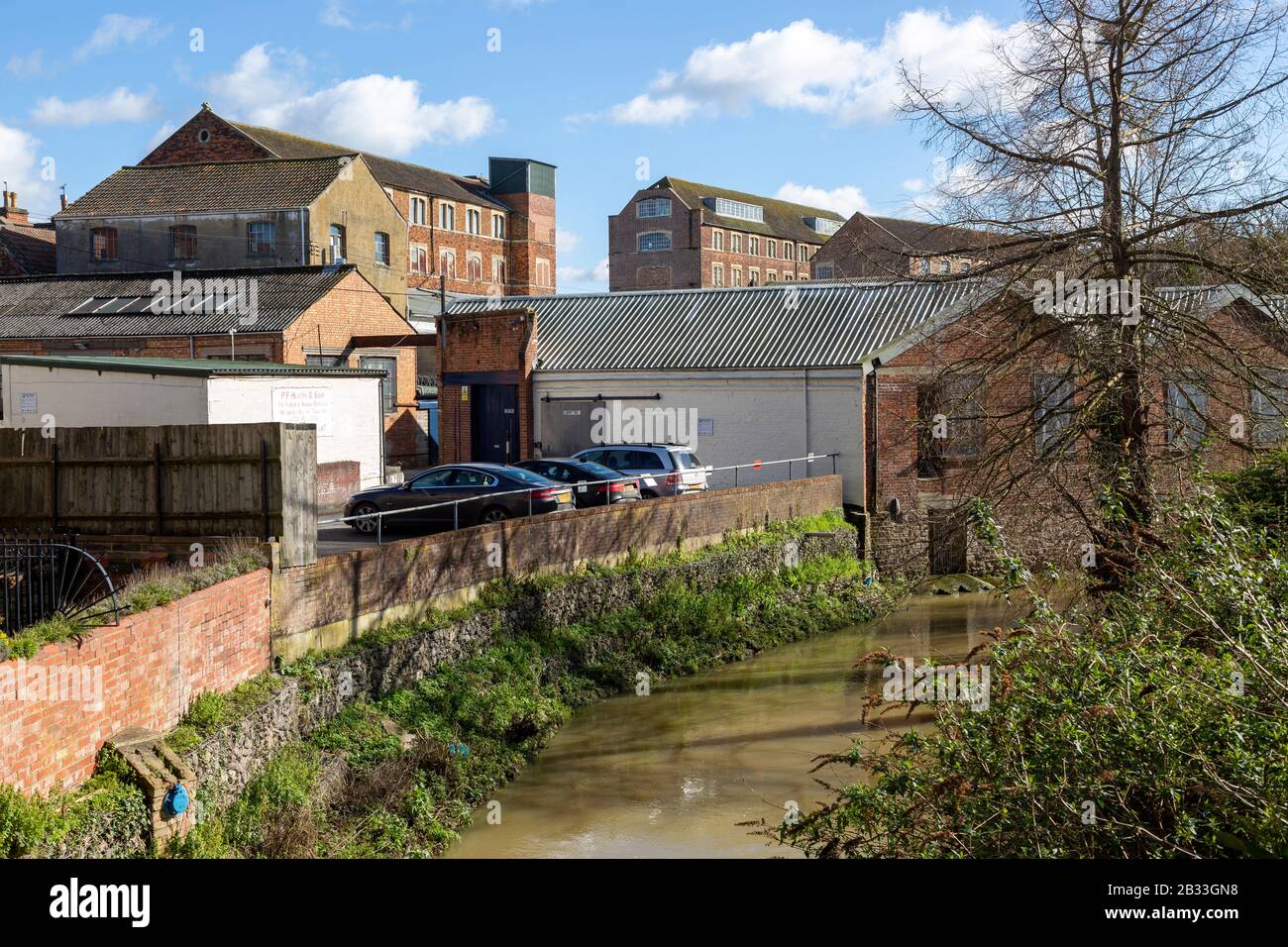 Industrial buildings on banks of River Biss in town centre of ...