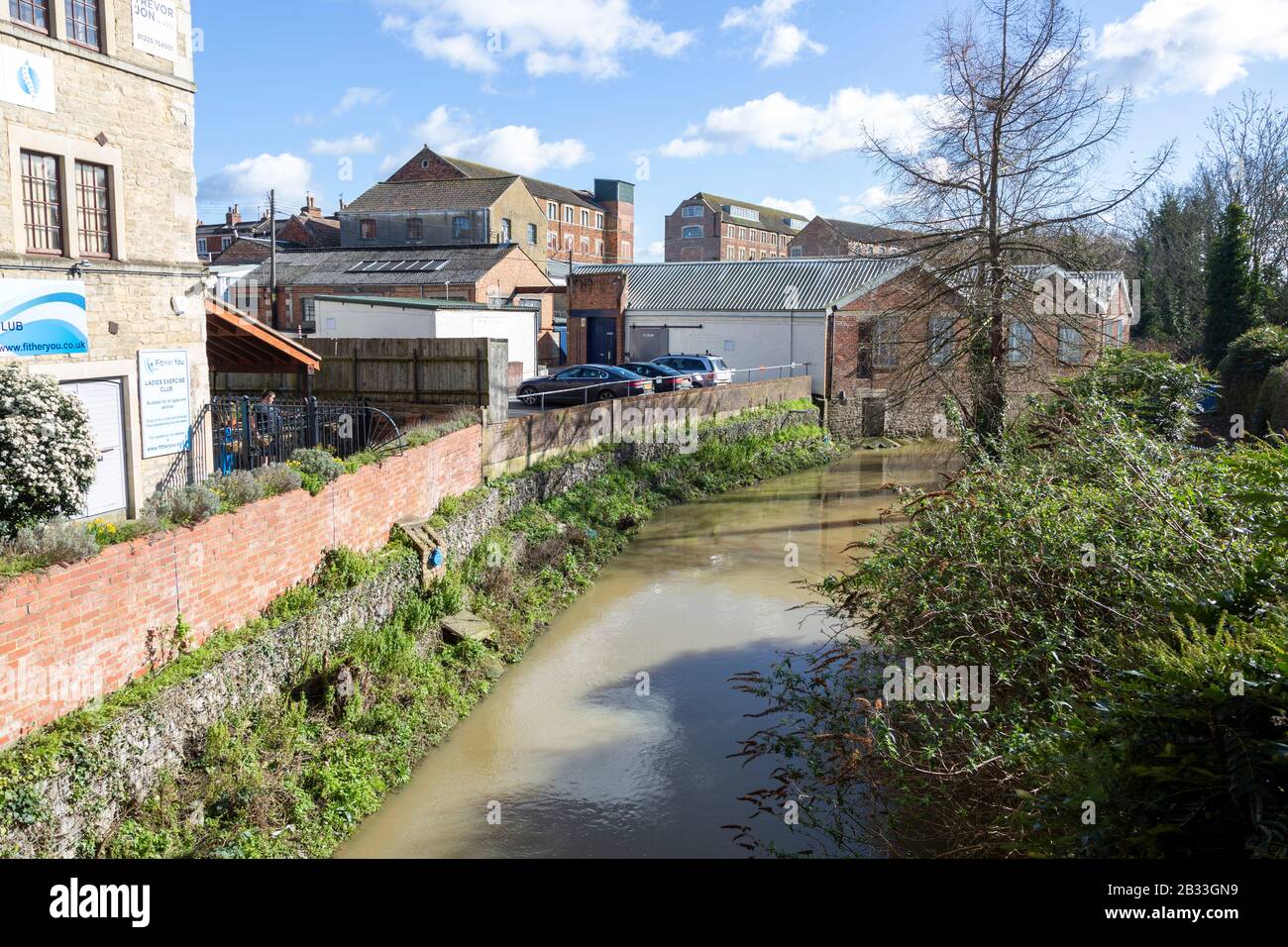 Industrial buildings on banks of River Biss in town centre of ...