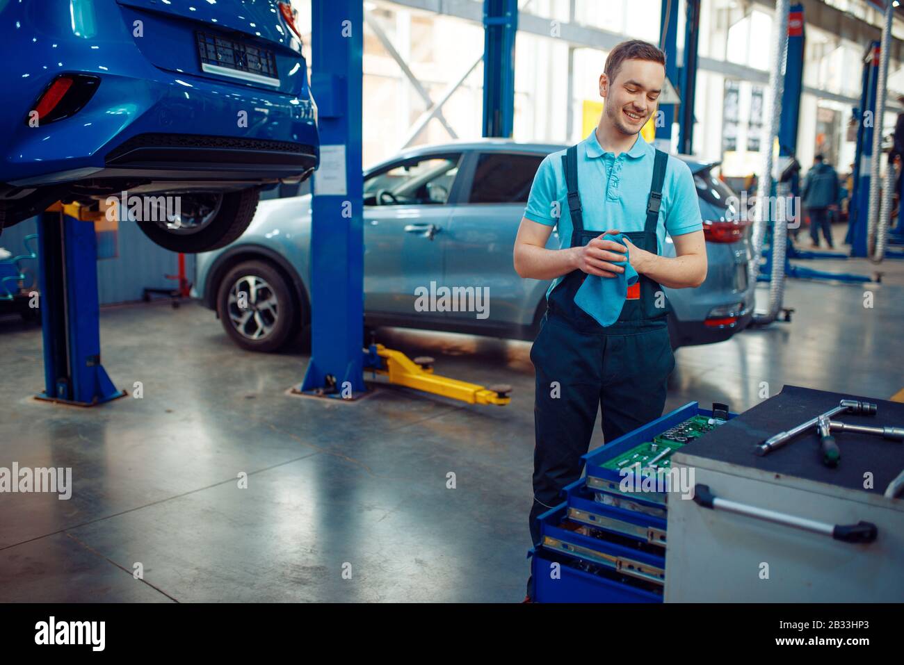 Man Lifts Car High Resolution Stock Photography and Images - Alamy
