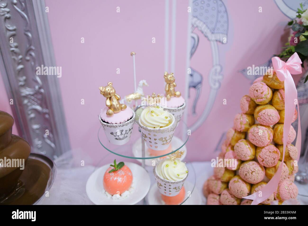 Many yummy sweet cakes and candies on wedding table Stock Photo - Alamy