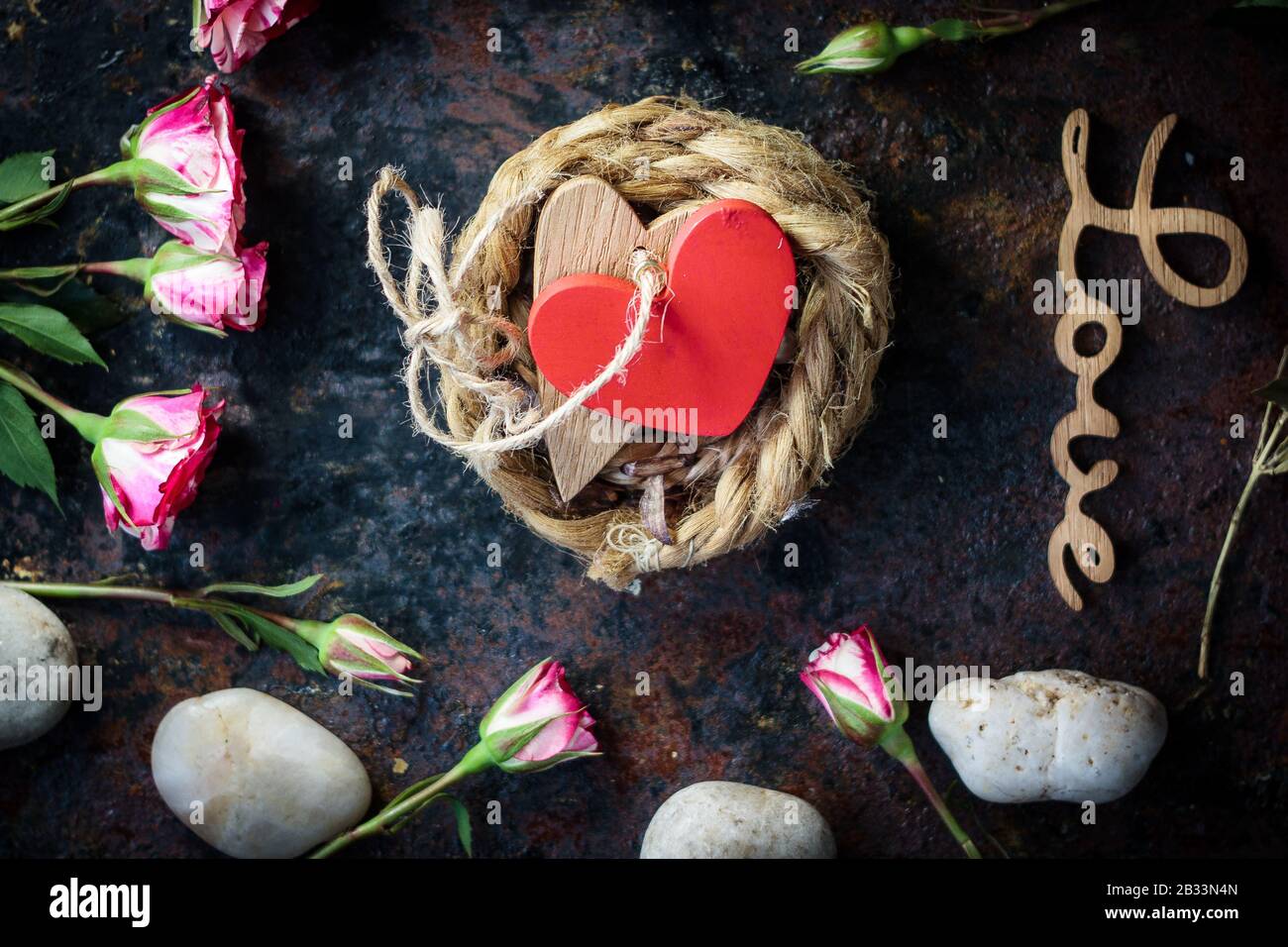 Two hearts bounded together on nest over black background Stock Photo ...