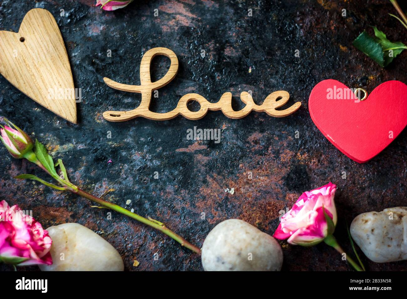 Letters LOVE on rustic background with hearts and flowers Stock Photo ...