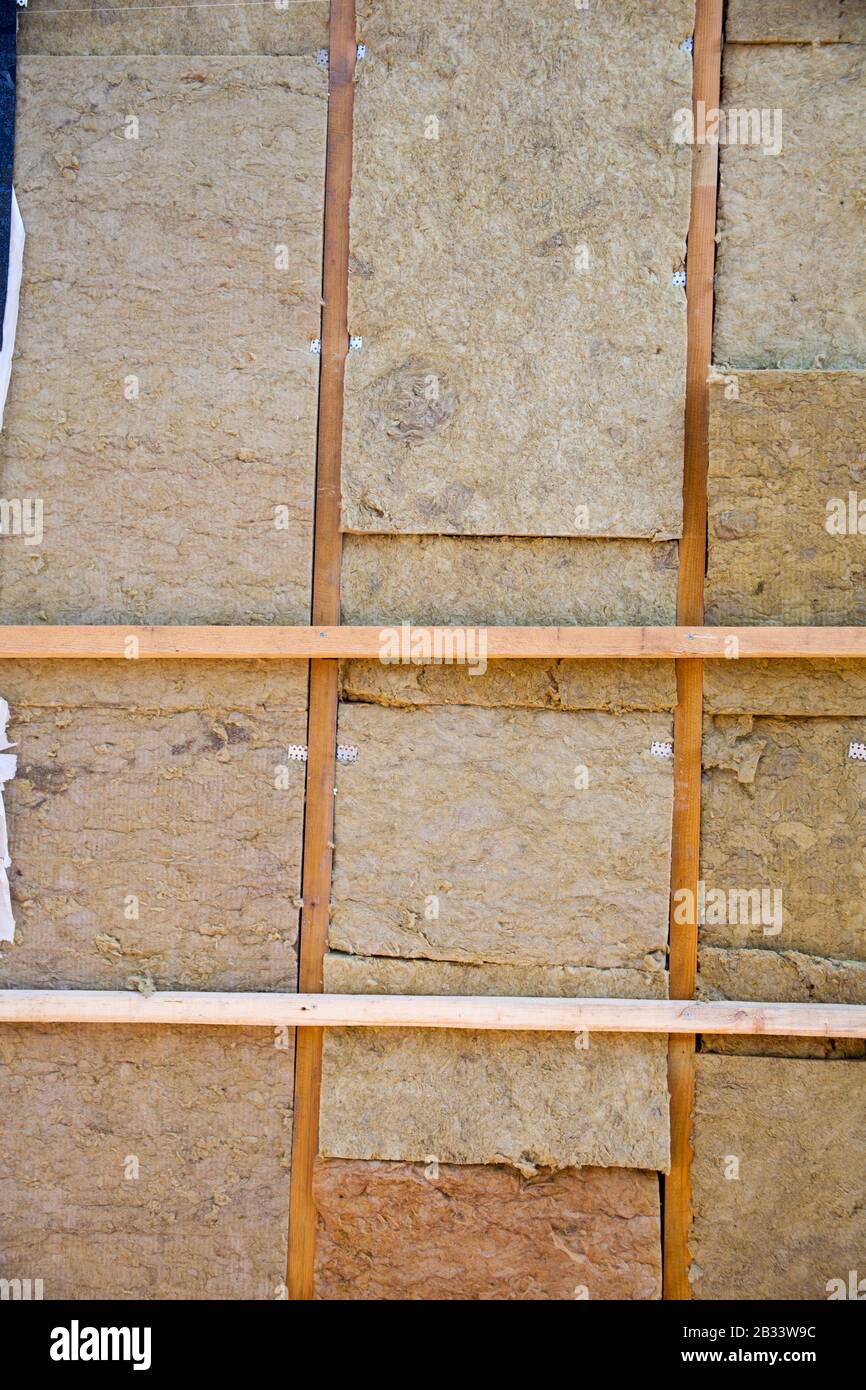 warming the walls of a stone house with a stone wool heater. Ecological ...