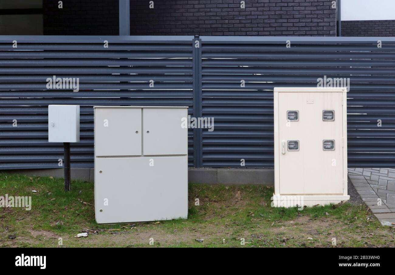 Metal boxes with electricity and natural gas counters meters are ...