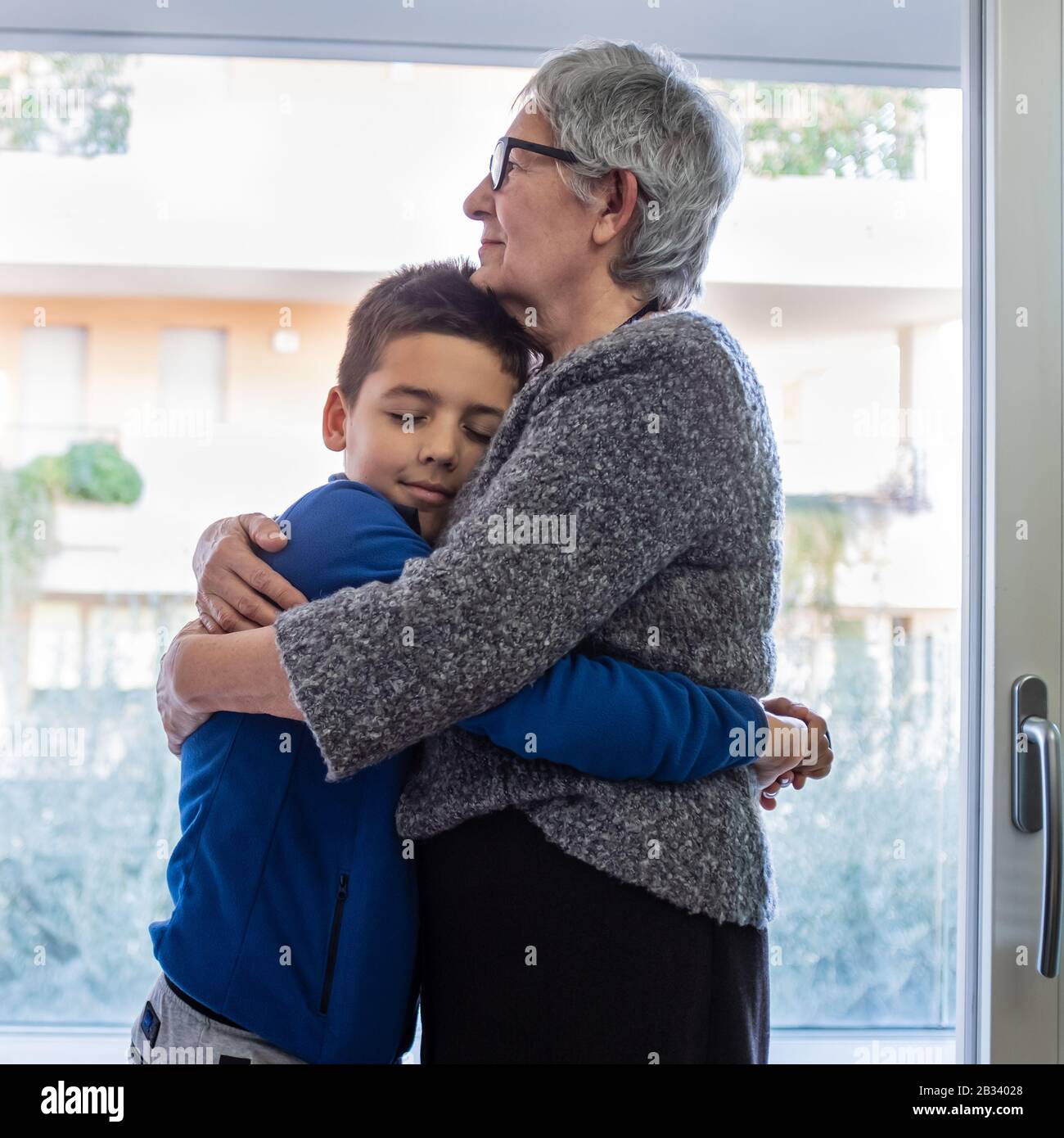 Grandmother grandson hug hi-res stock photography and images - Alamy