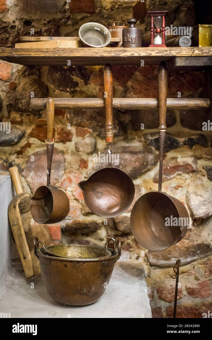 Copper ladles in the kitchen, pharmacy museum, Poland Stock Photo - Alamy