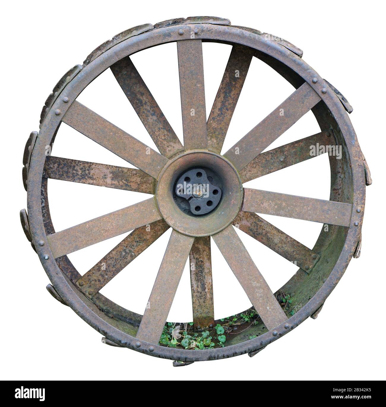 Rusty metal aged wheel from an retro agricultural retro vinage tractor ...