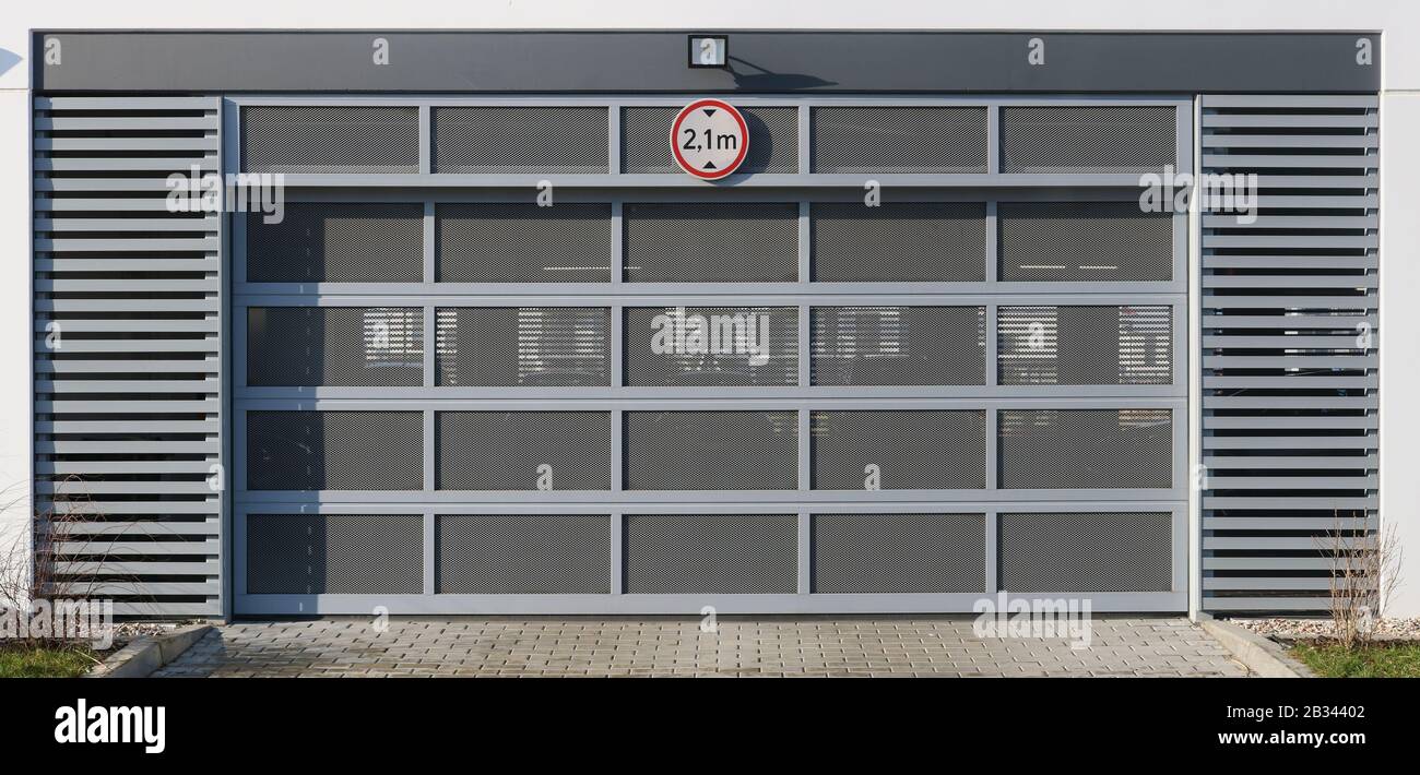 Steel armored grid gray closed gates to a large multi-level new city ...