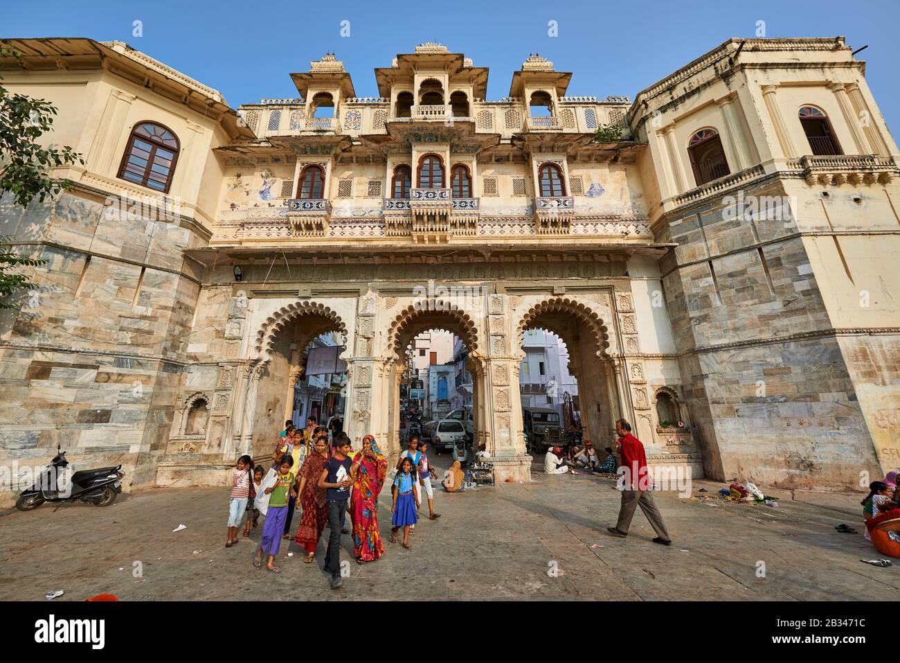 Women dressed in colorful saris at Gangaur Ghat, Udaipur, Rajasthan ...
