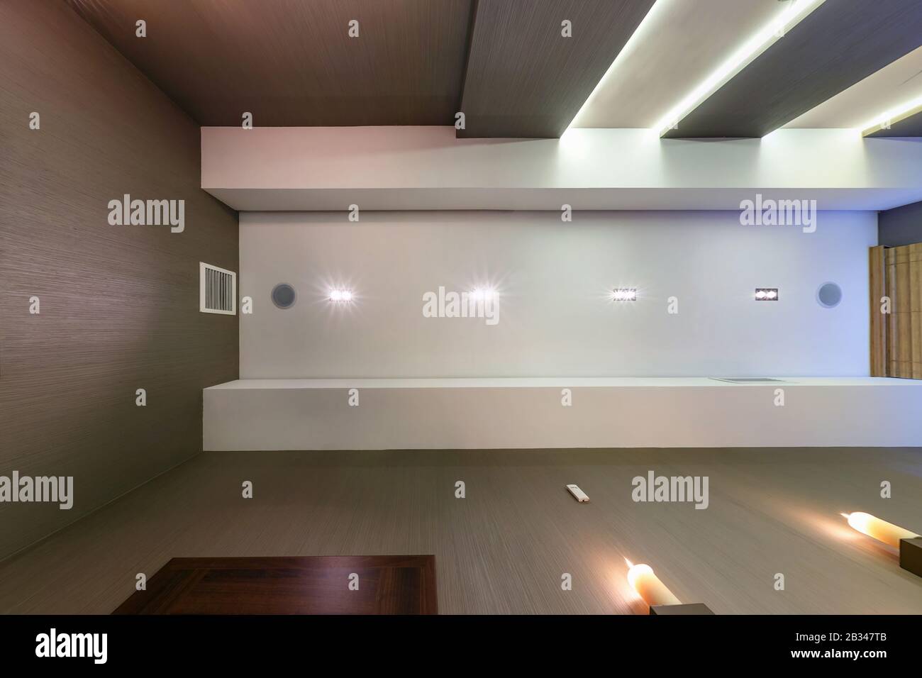 looking up on suspended ceiling with halogen spots lamps and drywall ...