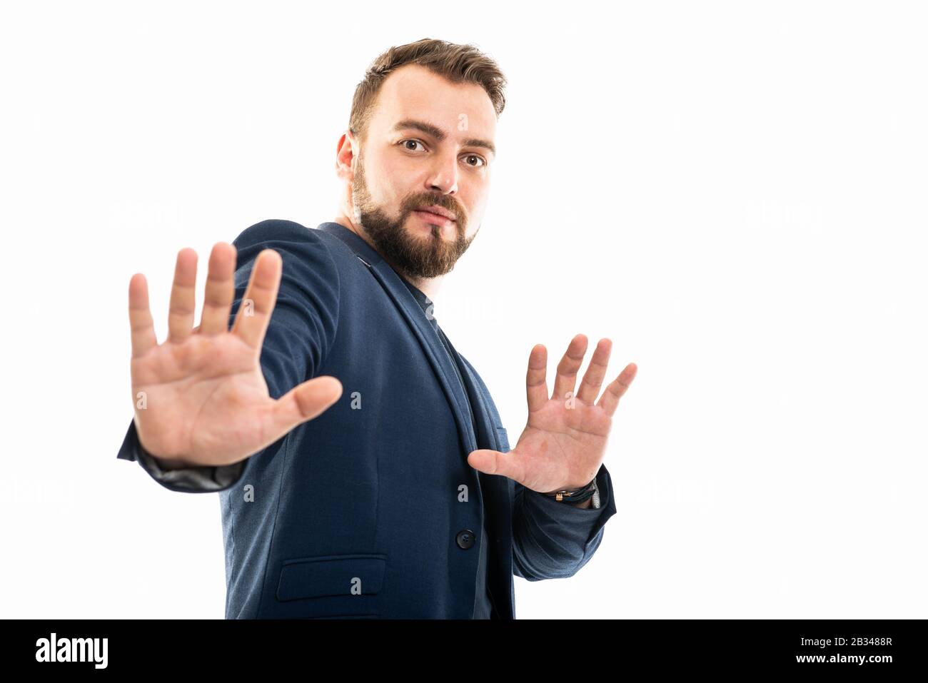 Business man wearing smart casual clothes showing stop gesture isolated ...