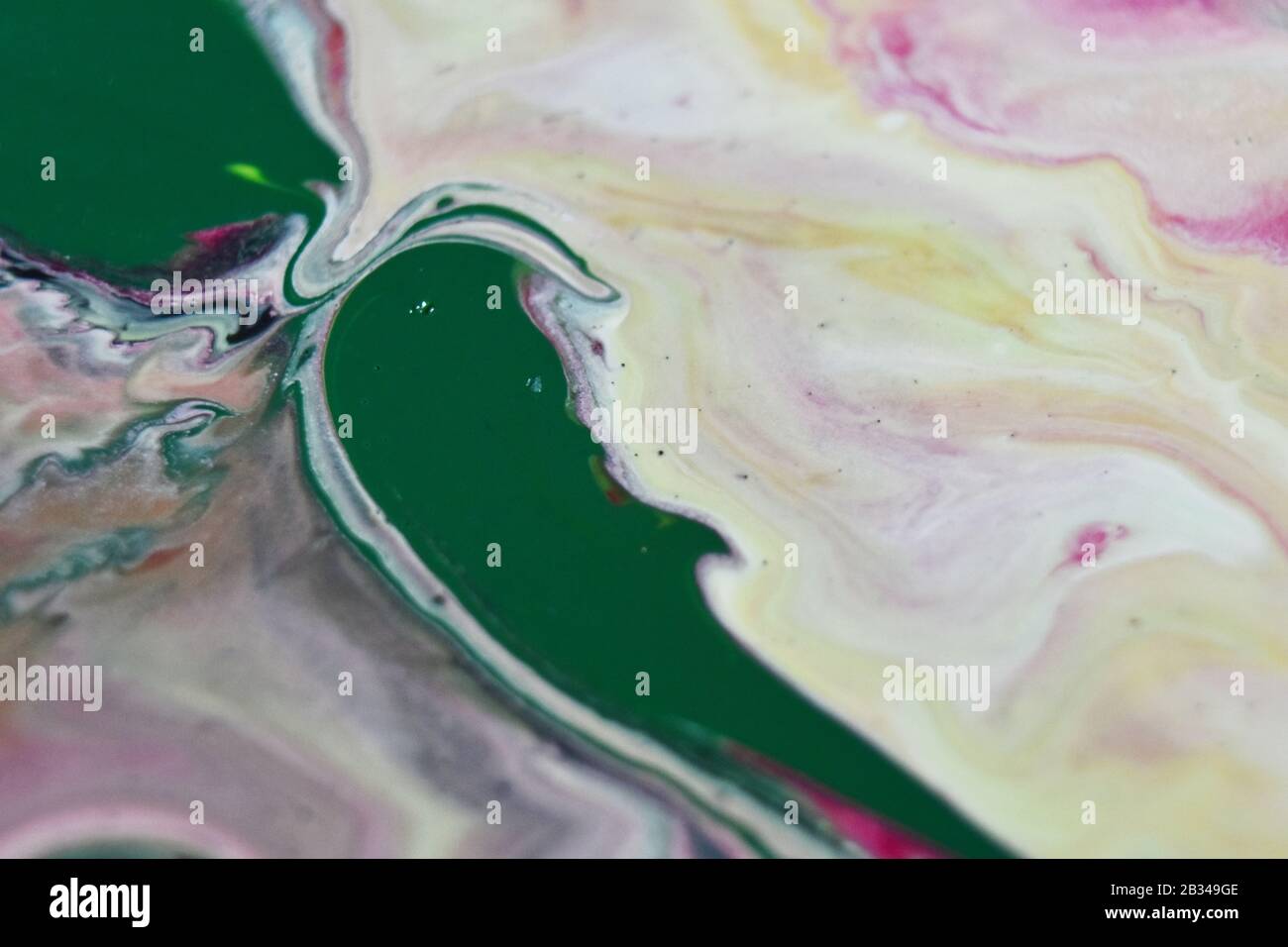 Patterns in the water with colorful mixed paints Stock Photo - Alamy