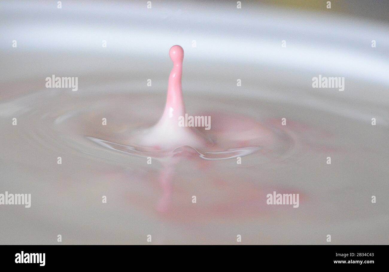 Closeup shot of a white liquid drop with a rippled surface Stock Photo ...