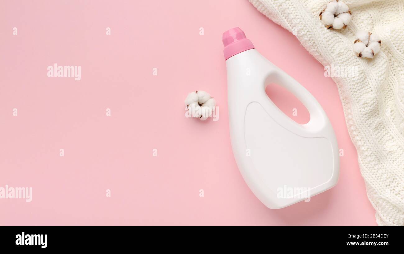 White plastic packaging of laundry detergent and soft sweater Stock ...