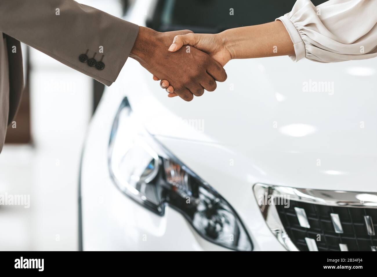 Two hands shaking car in hi-res stock photography and images - Alamy