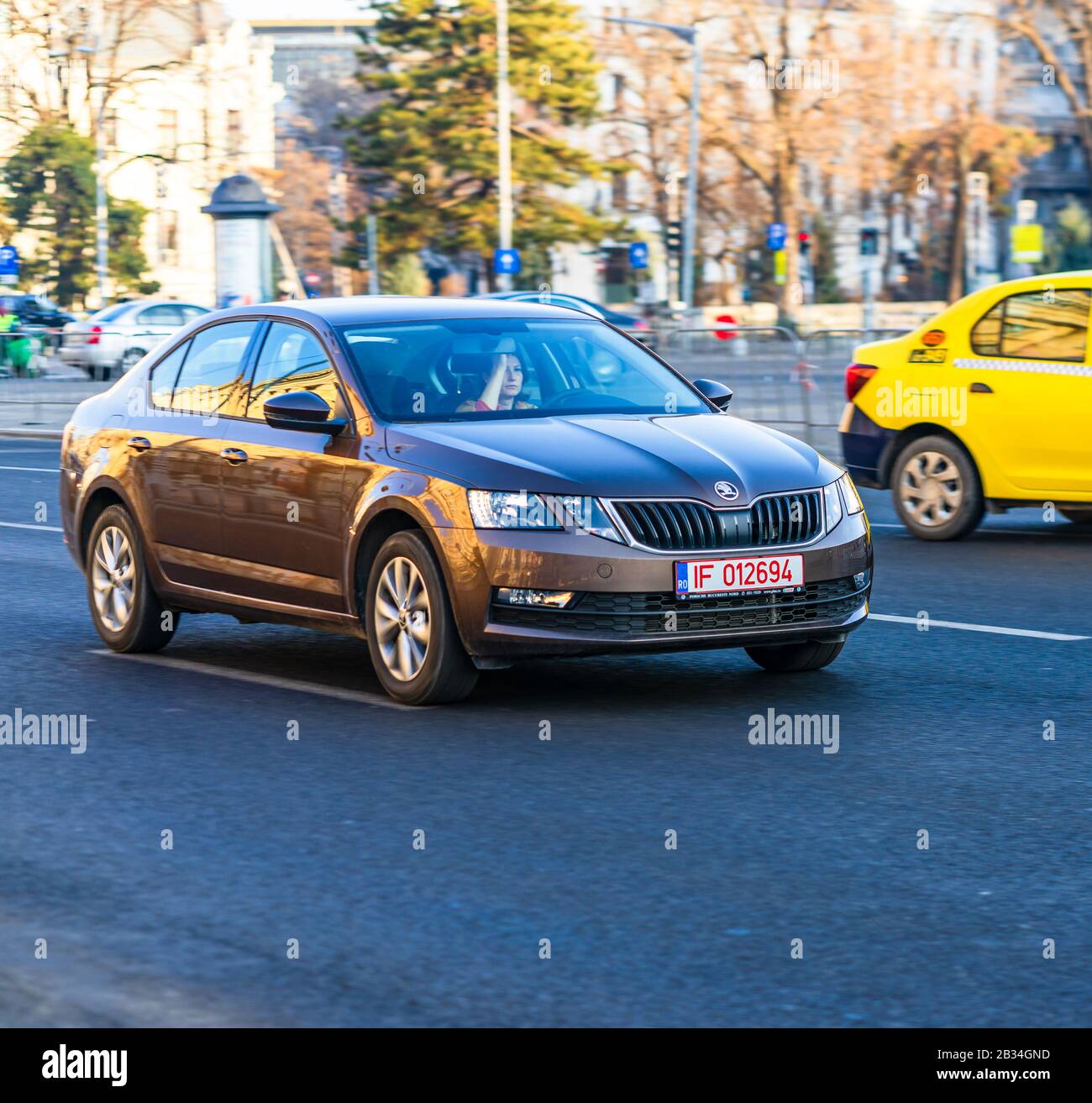 New modern car Skoda Octavia in traffic of downtown Bucharest, Romania ...