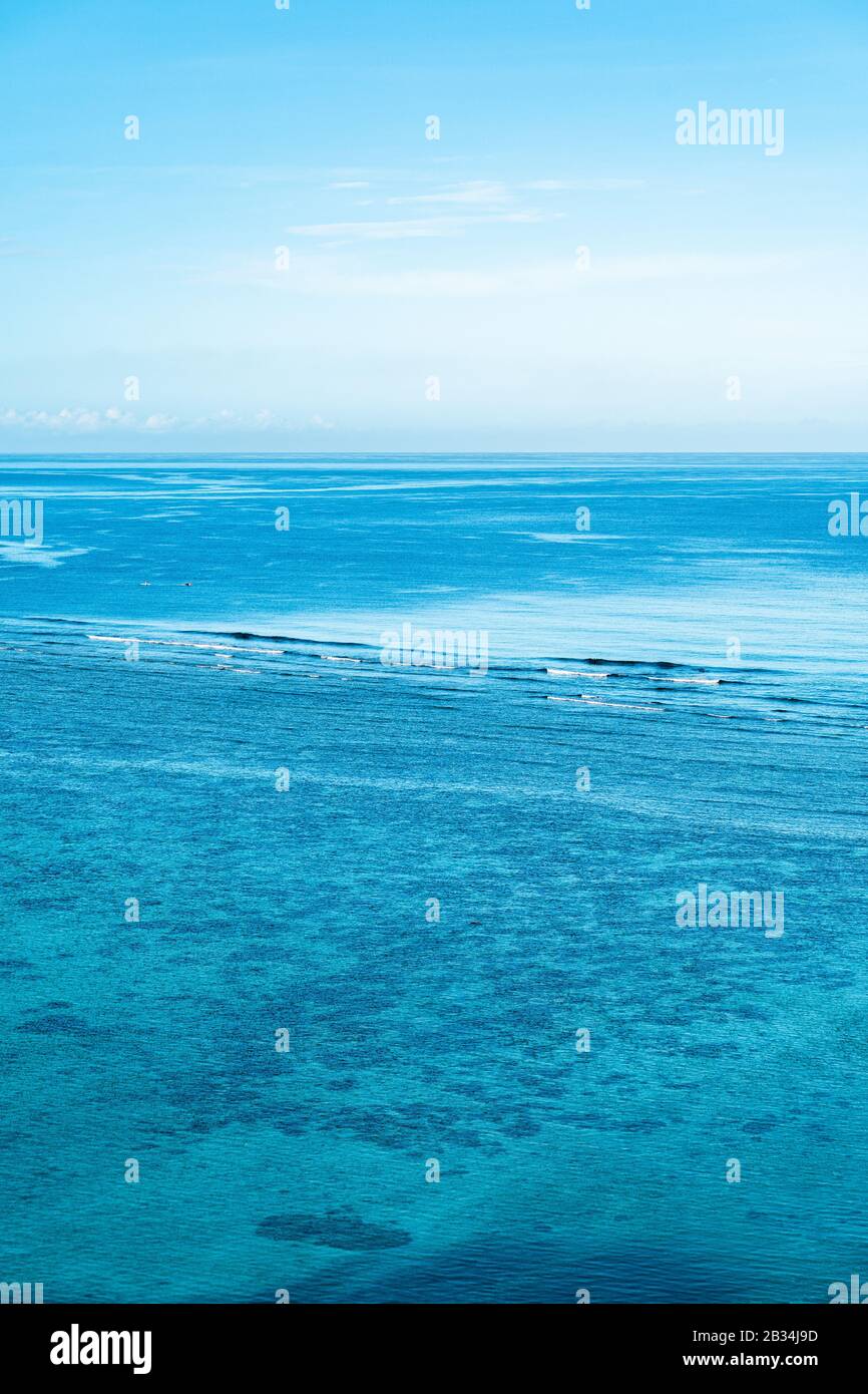 Vertical high angle view of the pure blue ocean during the daytime ...