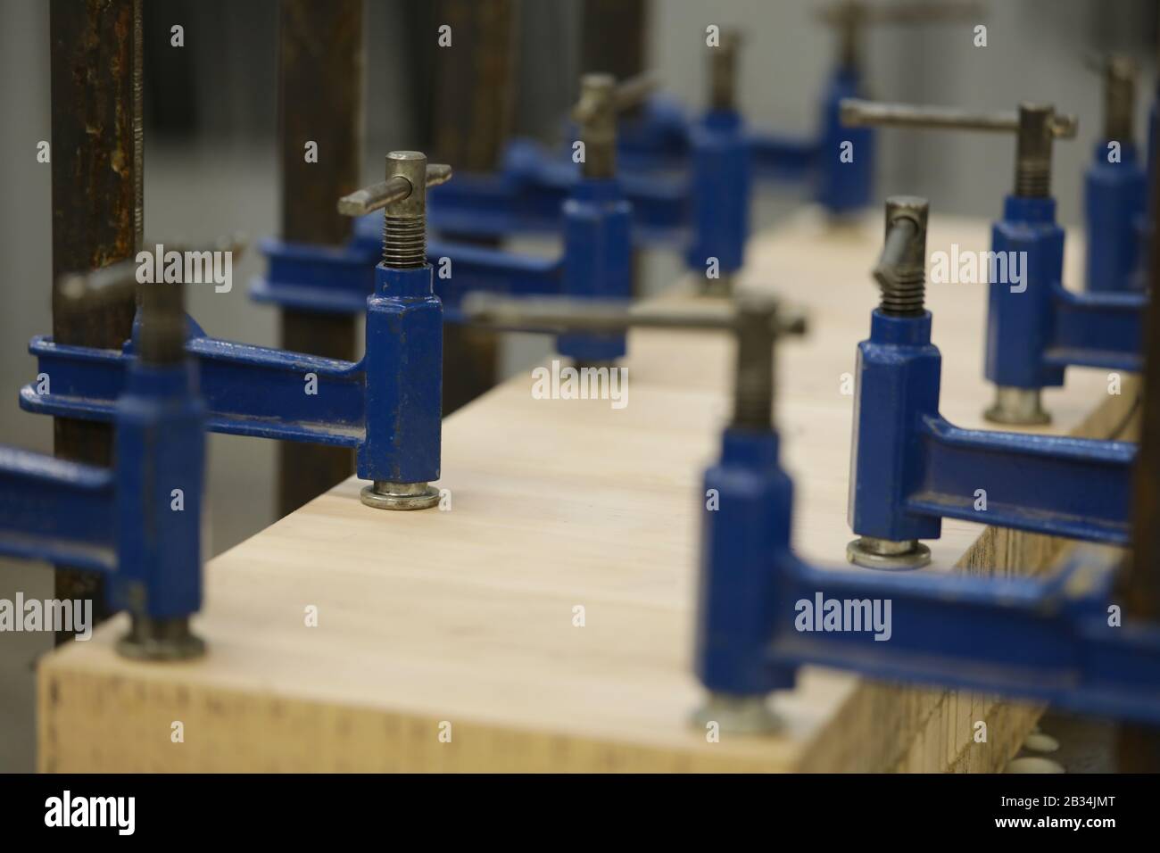 New blue metal clamp Stock Photo - Alamy