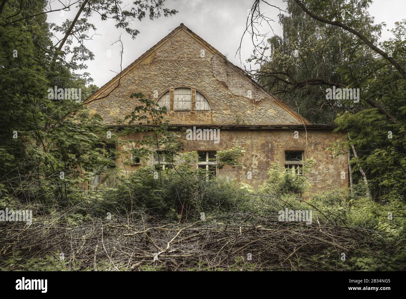 Old house construction surrounded by trees and grass Stock Photo - Alamy
