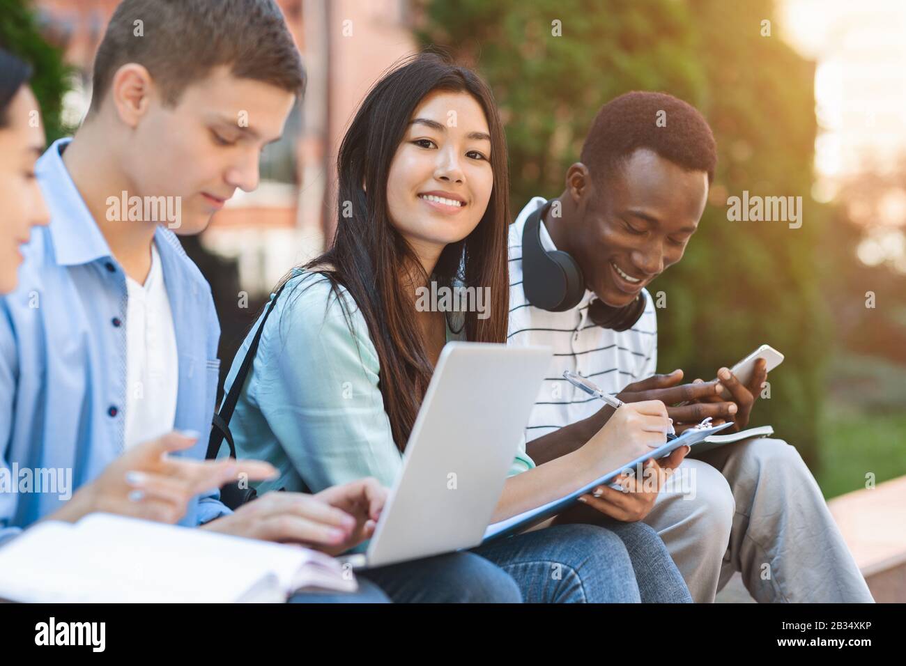 Happy Teens International Students Studying Together Outdoors, Enjoying ...