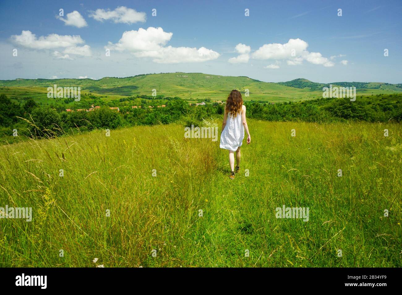 Woman windy day dress High Resolution Stock Photography and Images - Alamy