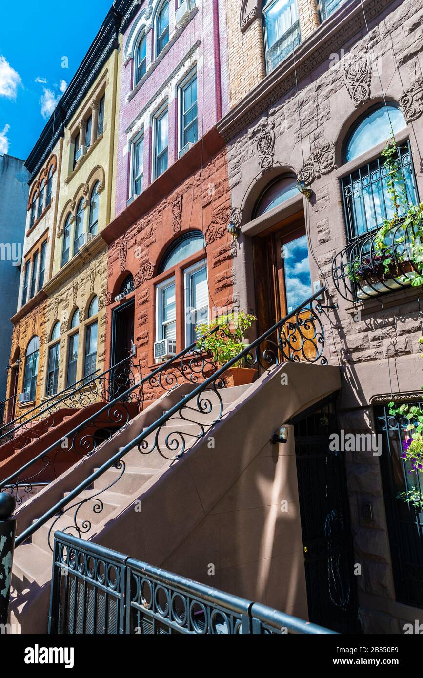 Old typical multicolor houses in the Harlem neighborhood in Manhattan ...