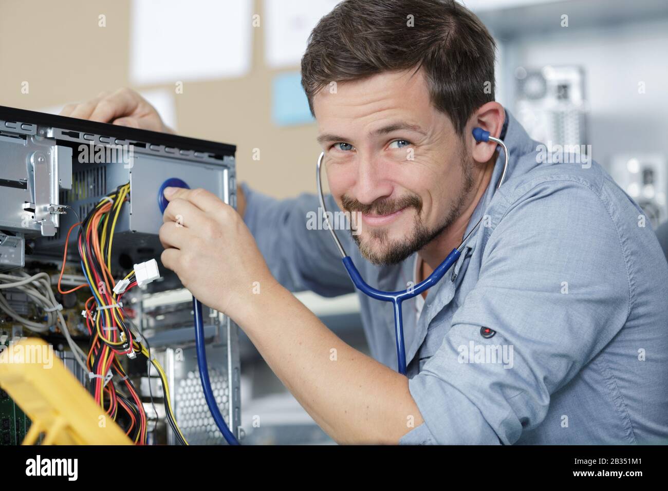computer engineer working on broken console Stock Photo - Alamy