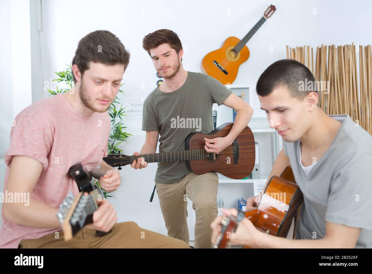 young men with musical instruments Stock Photo - Alamy