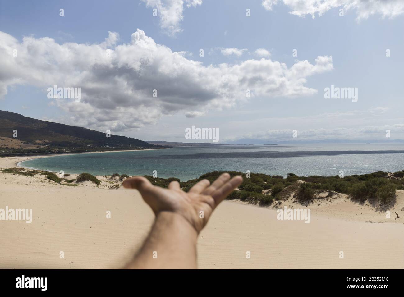 one hand shows us the landscape Stock Photo - Alamy