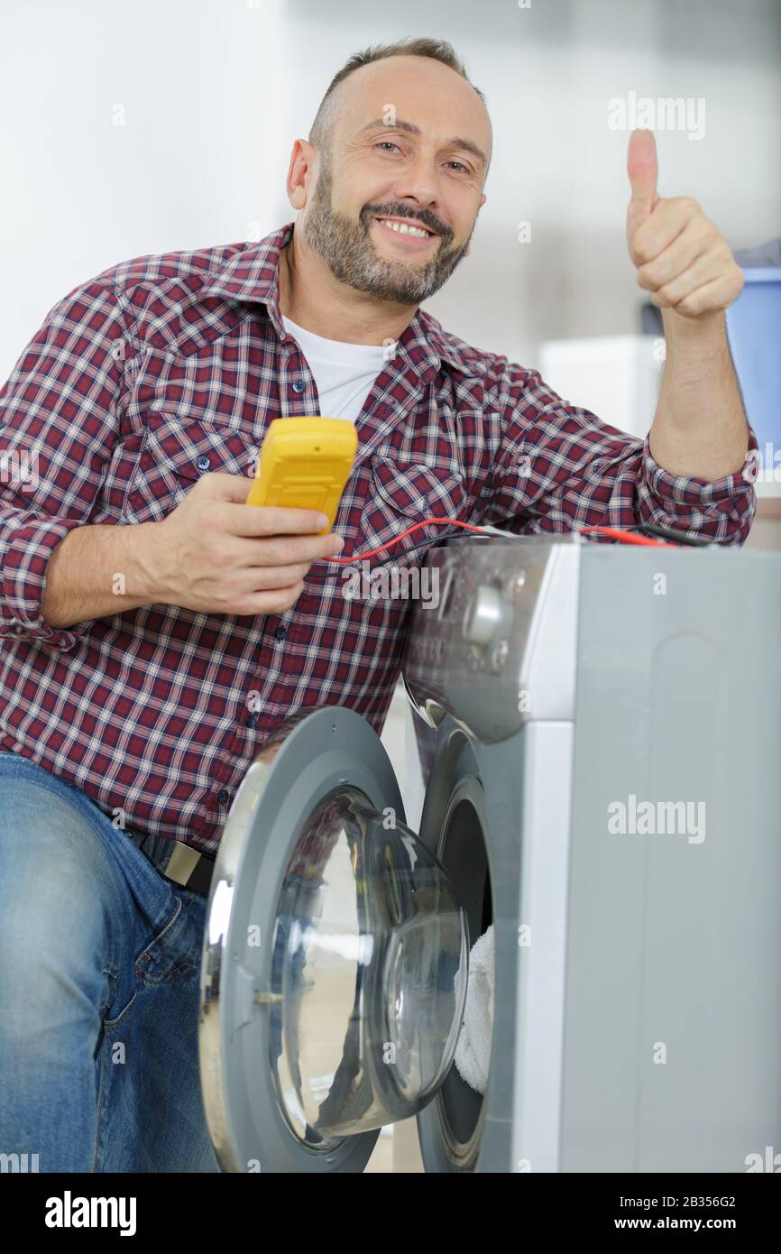 Hand holding multimeter hi-res stock photography and images - Alamy