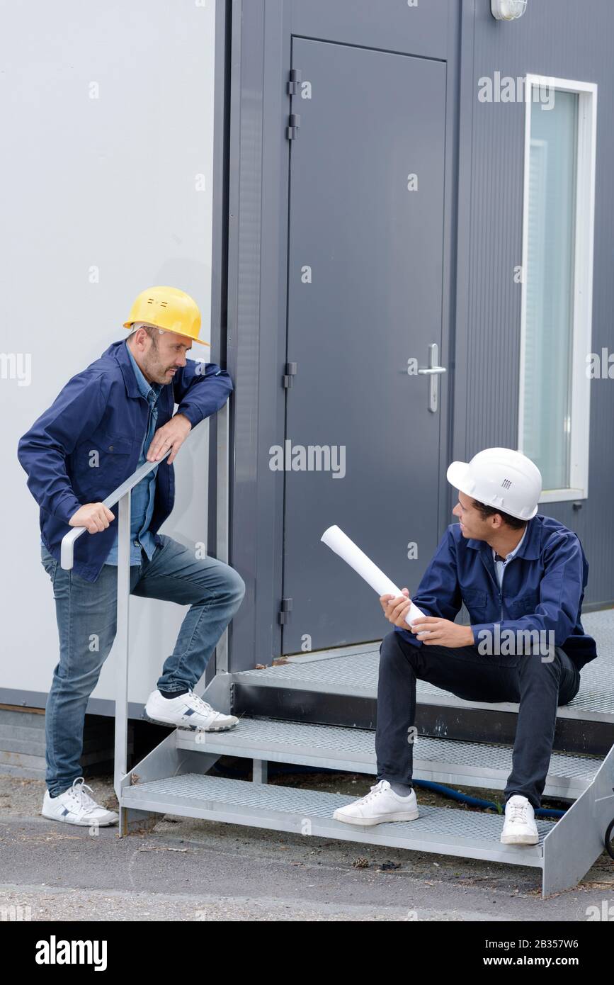 Two engineers talking white background hi-res stock photography and ...