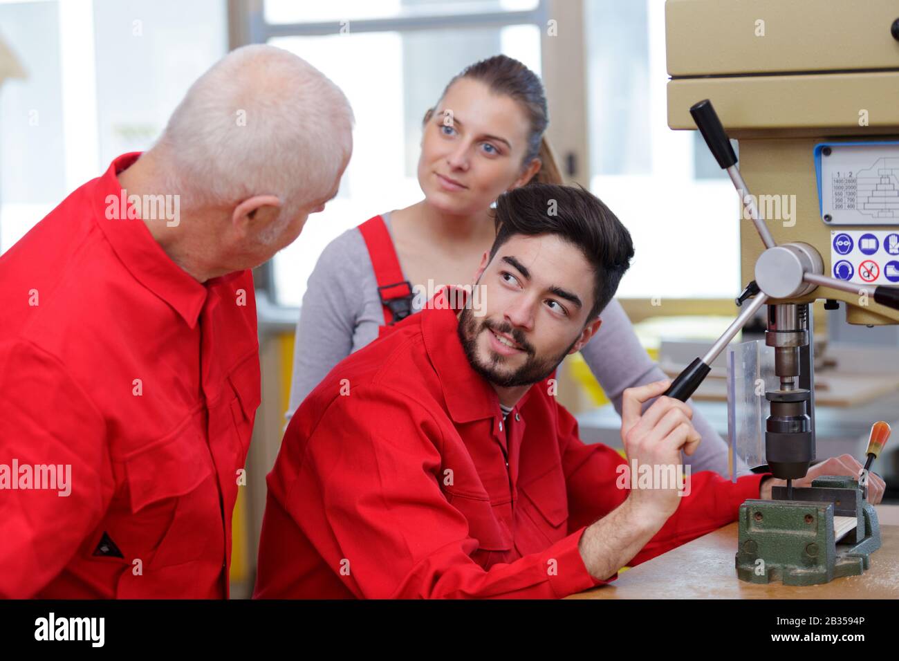 student and teacher in carpentry class using circular saw Stock Photo ...