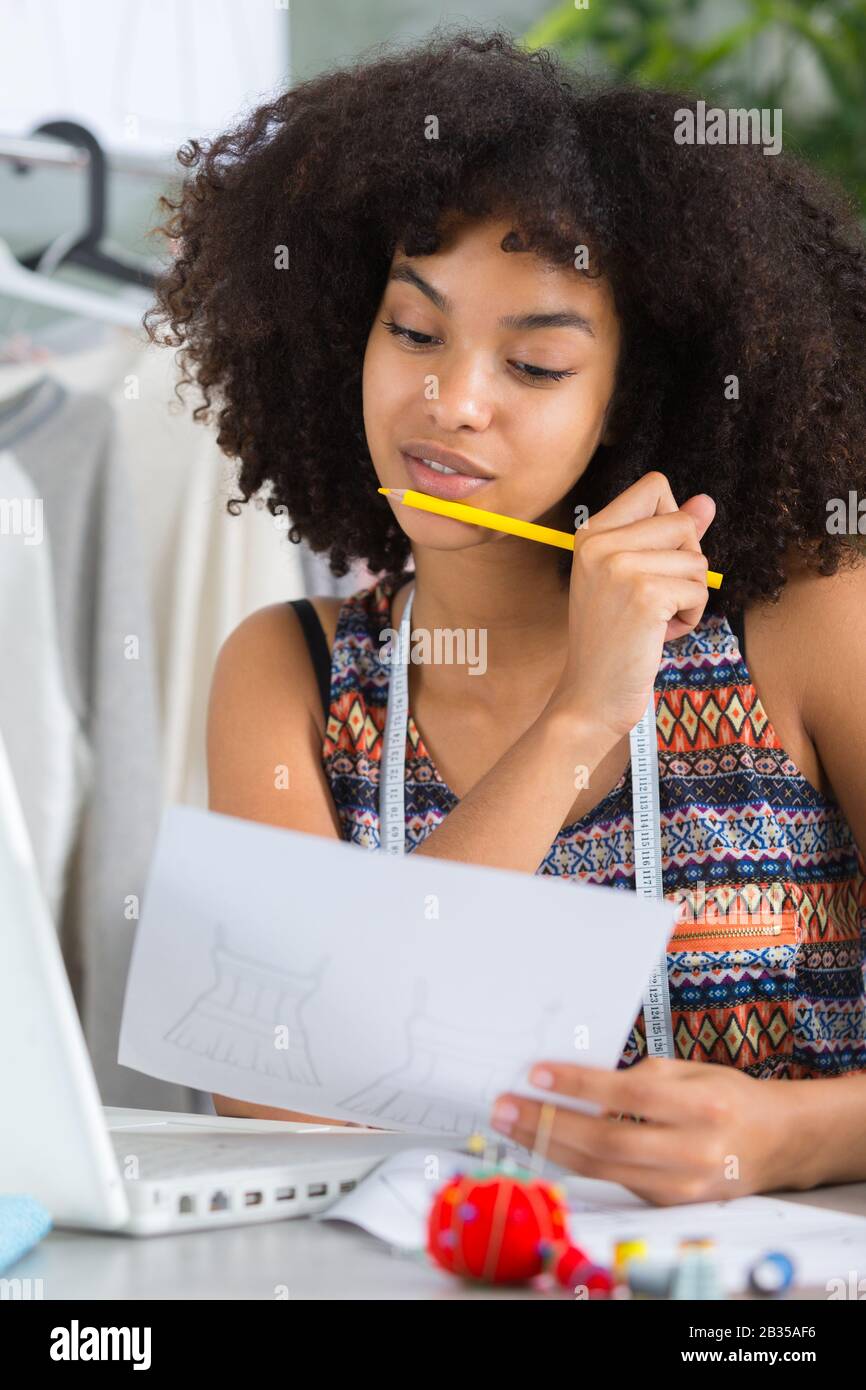 female designer happy with her new design Stock Photo - Alamy