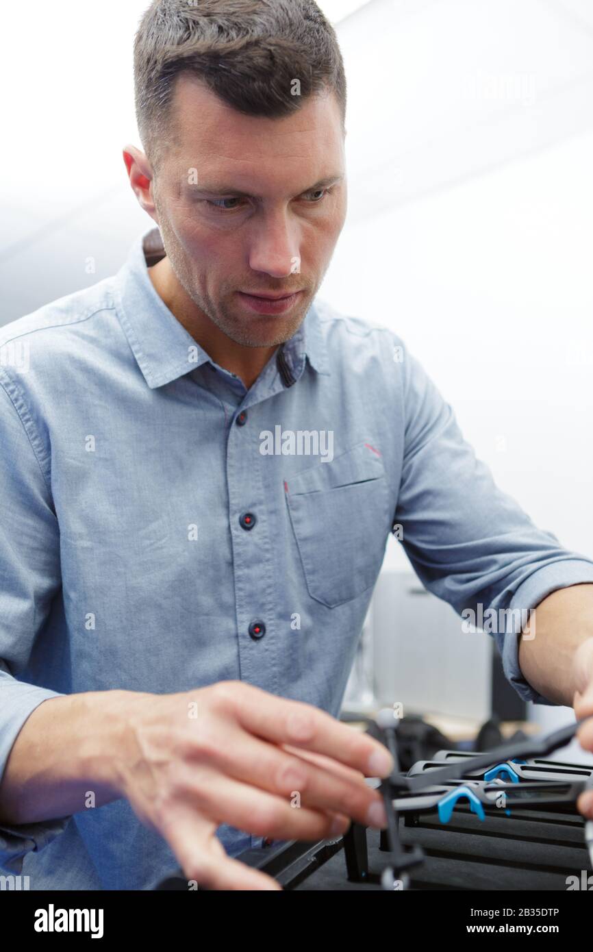engineer operating industrial machinery in a factory Stock Photo - Alamy