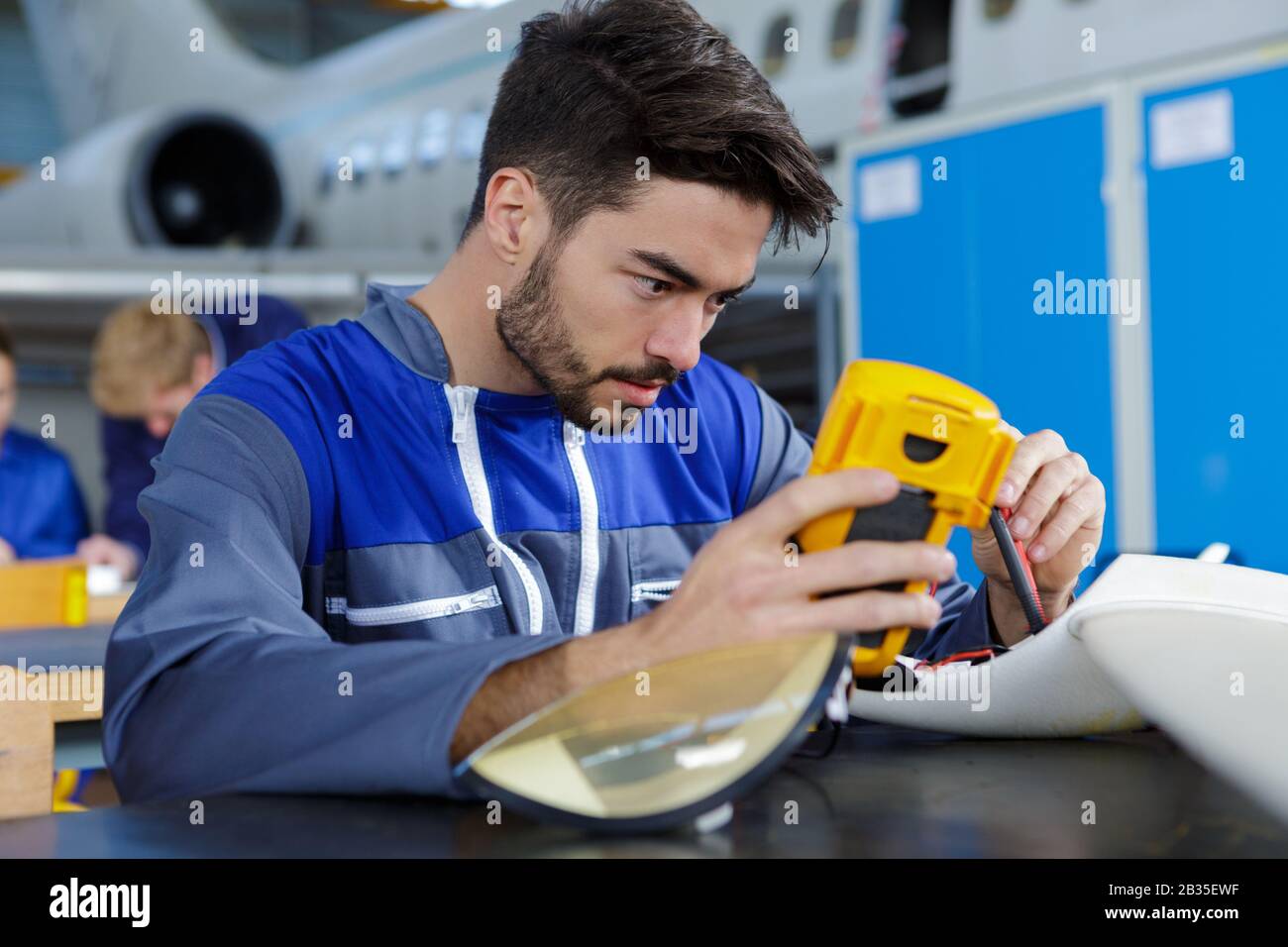 a man measures the voltage Stock Photo - Alamy