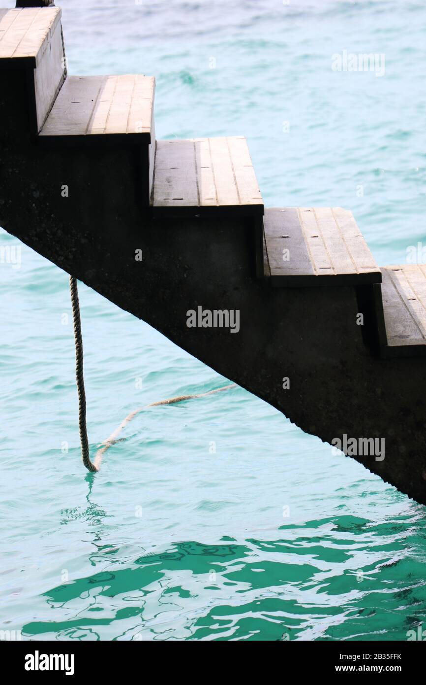 close up of wooden stairs into sea on malaysian island Stock Photo - Alamy