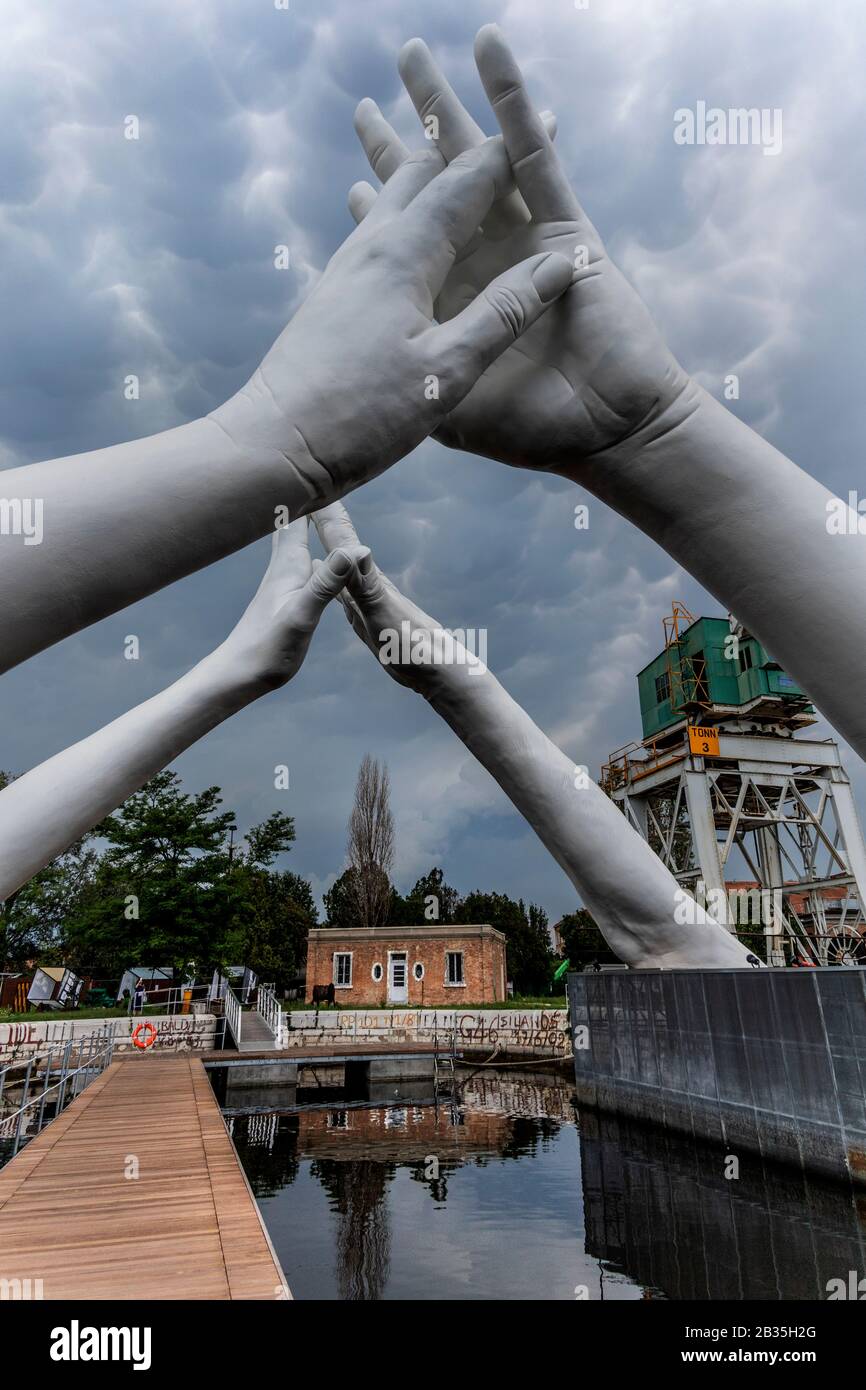 Italian artist Lorenzo Quinn builds bridges over Venice Arsenale, Italy ...