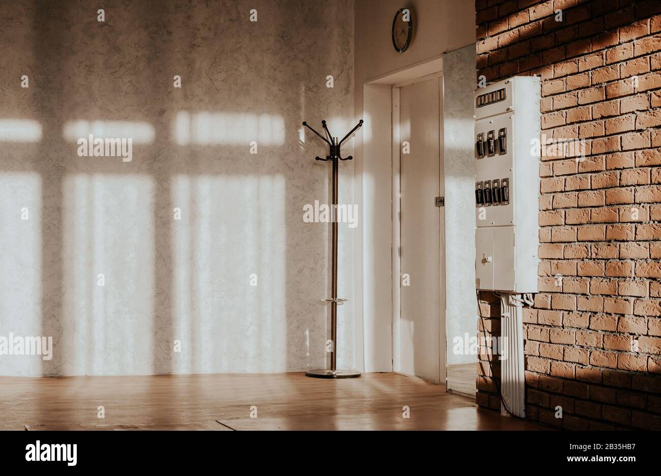 Interior of an empty room with a brick wall Stock Photo - Alamy